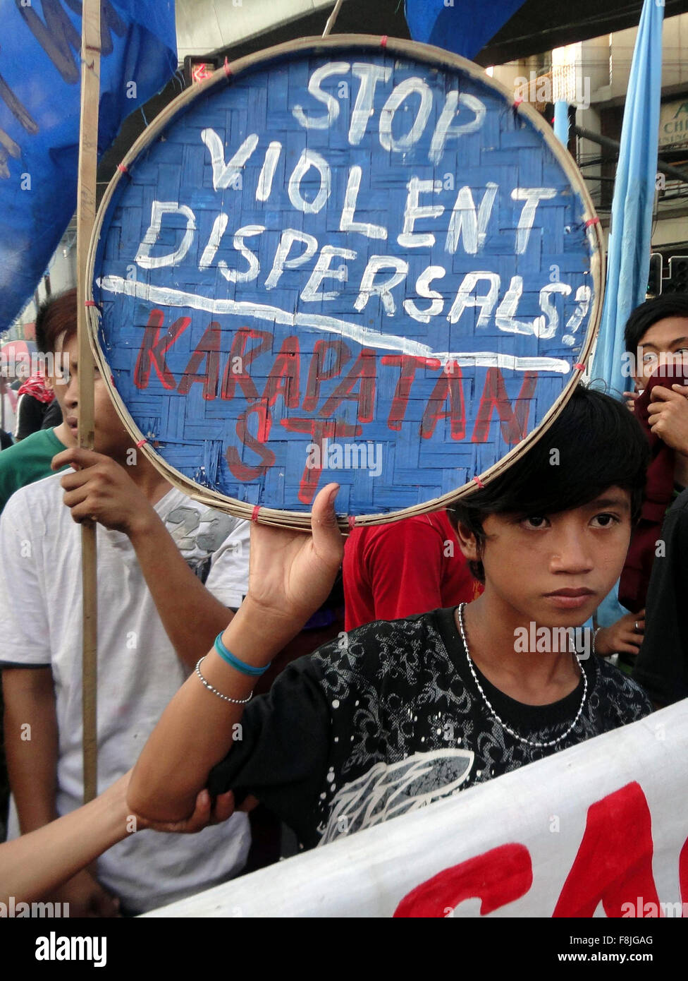 Manila, Philippines. 10th Dec, 2015. A Filipino protester holds a ...