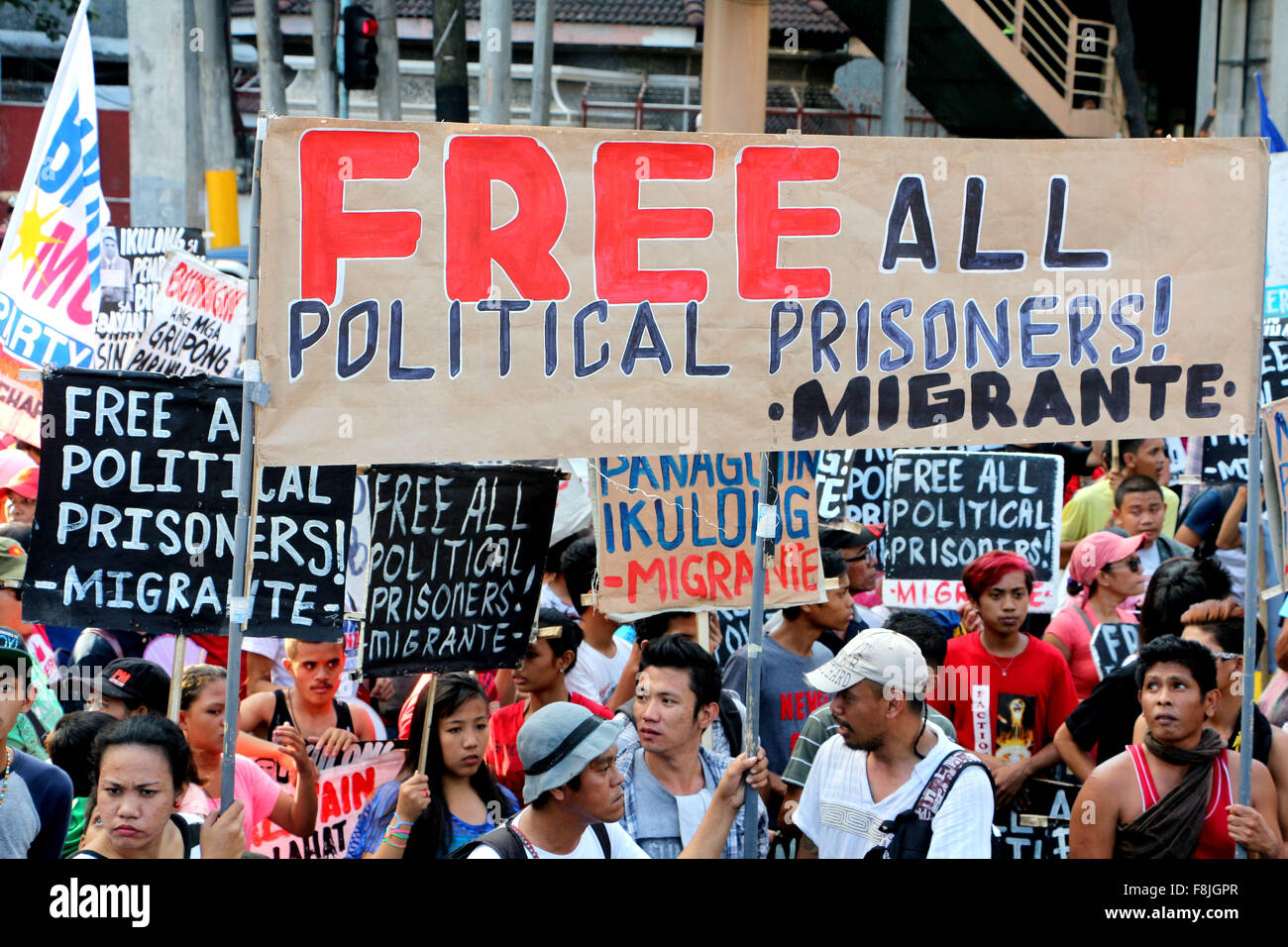 Manila, Philippines. 10th Dec, 2015. Activists bring banner and march ...
