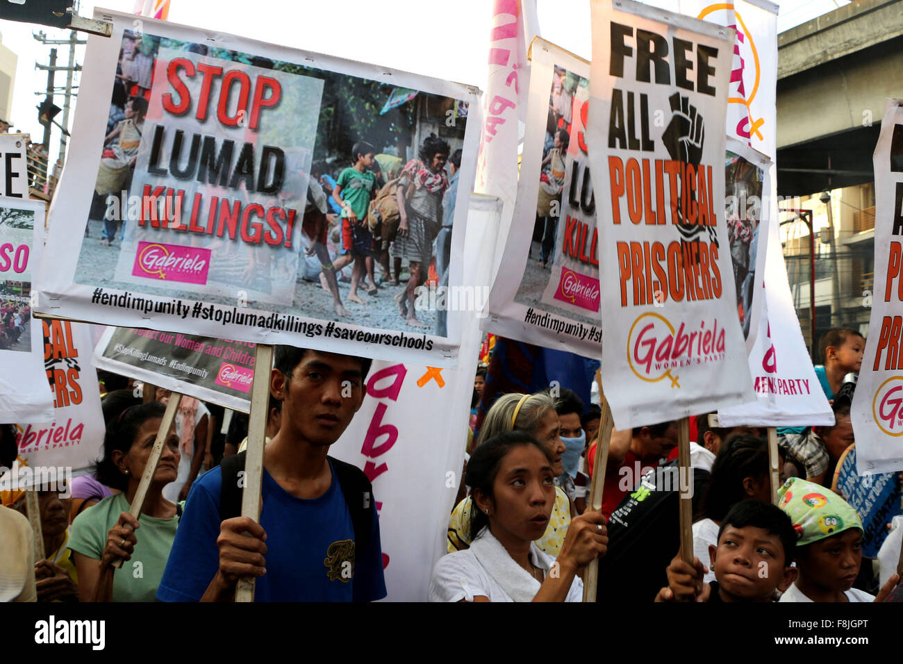 Manila, Philippines. 10th Dec, 2015. Activists bring banners during a ...