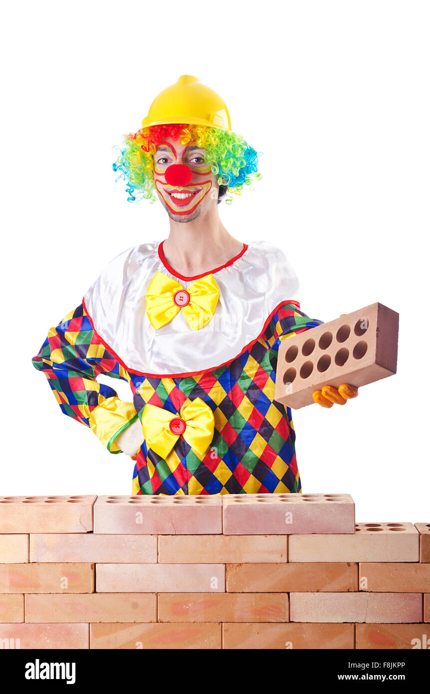 Bad construction concept with clown laying bricks Stock Photo - Alamy