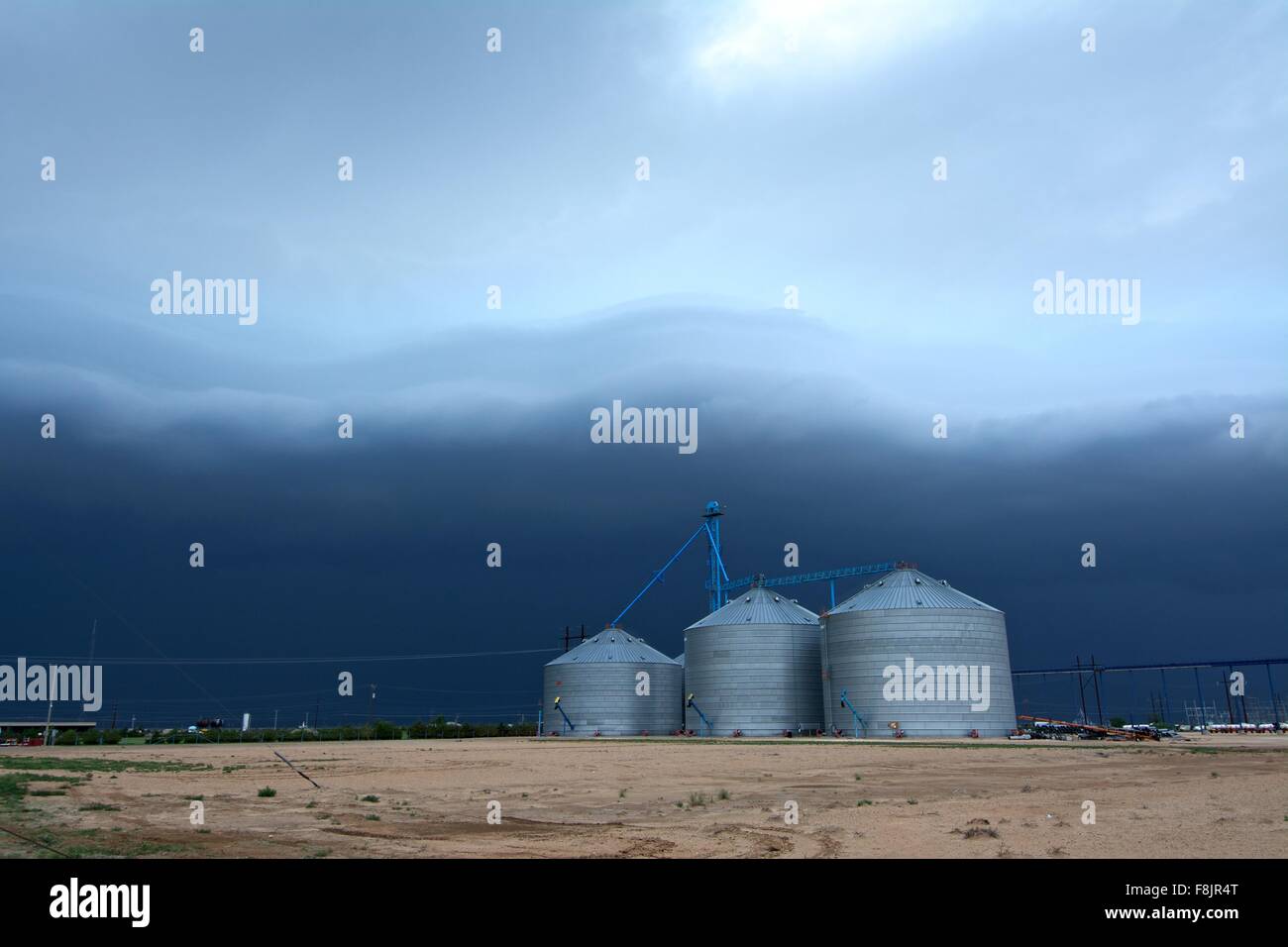 Arcus cloud from storm over grain silos, Dalhart, Texas, USA Stock ...
