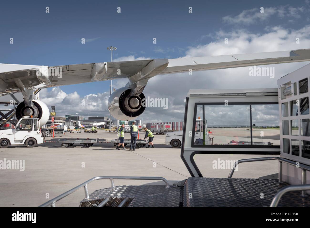Ground crew loading A380 jet aircraft at airport Stock Photo - Alamy