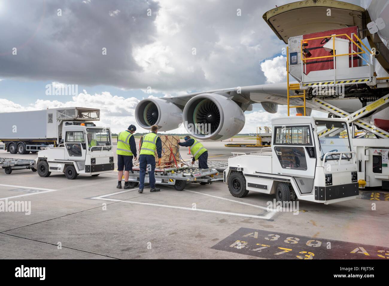 Ground crew loading freight onto A380 aircraft Stock Photo - Alamy