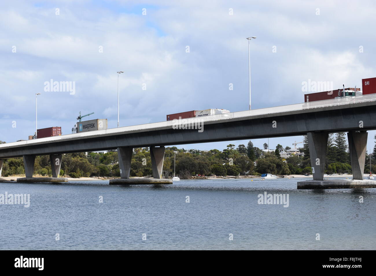 Container trucks travelling along the Stirling Bridge, Fremantle ...