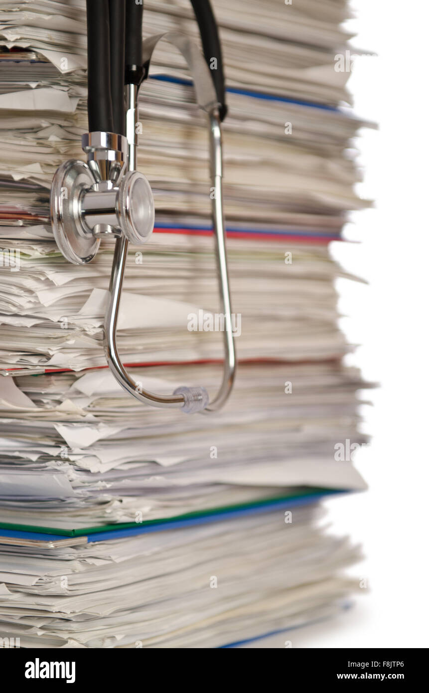 Stack of papers with stethoscope Stock Photo - Alamy