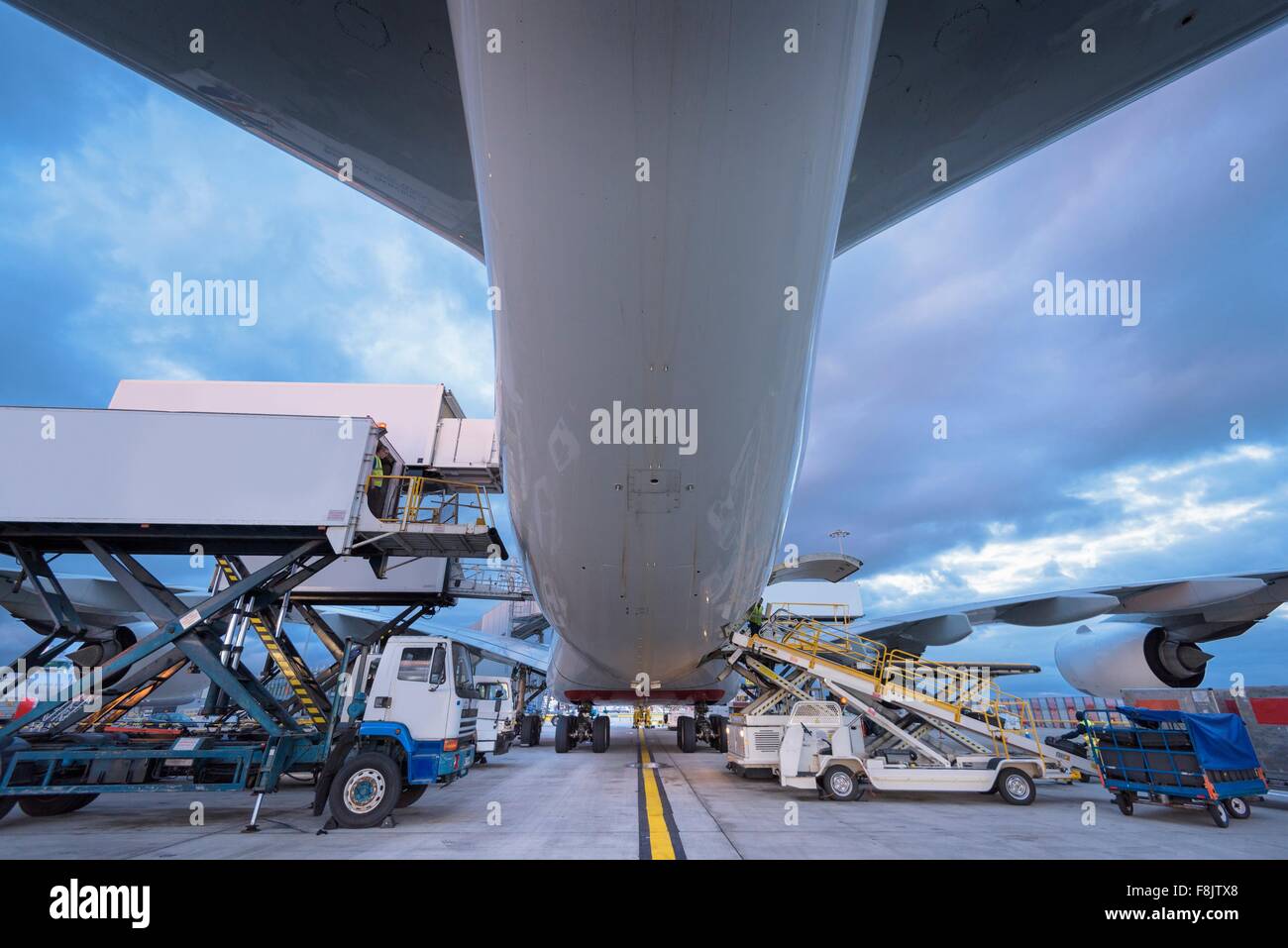 Ground crew loading A380 aircraft at airport Stock Photo - Alamy