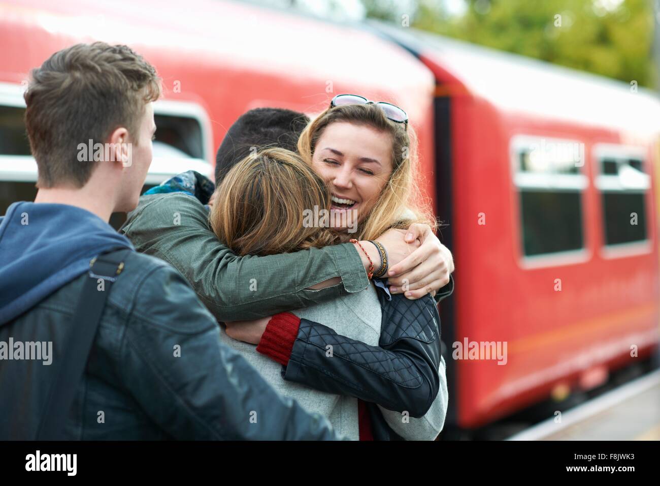 Group of people rear view hugging hi-res stock photography and images ...