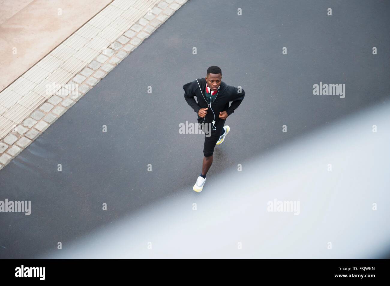 Young man running outdoors, elevated view Stock Photo - Alamy
