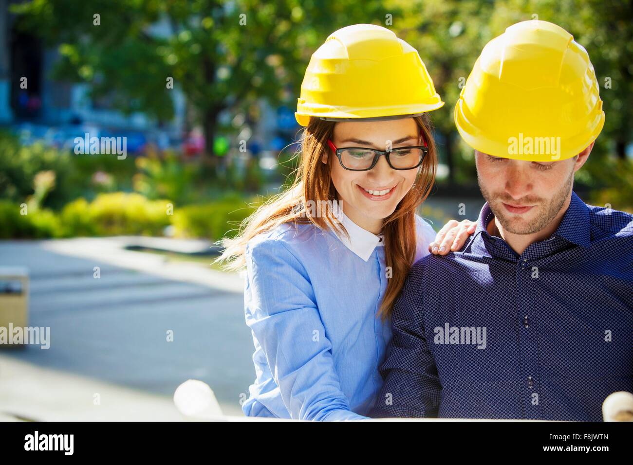 Building contractors wearing hard hats Stock Photo - Alamy