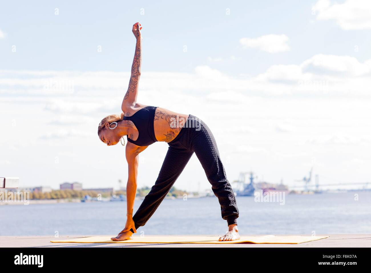 Woman bending over touching toes hi-res stock photography and images ...