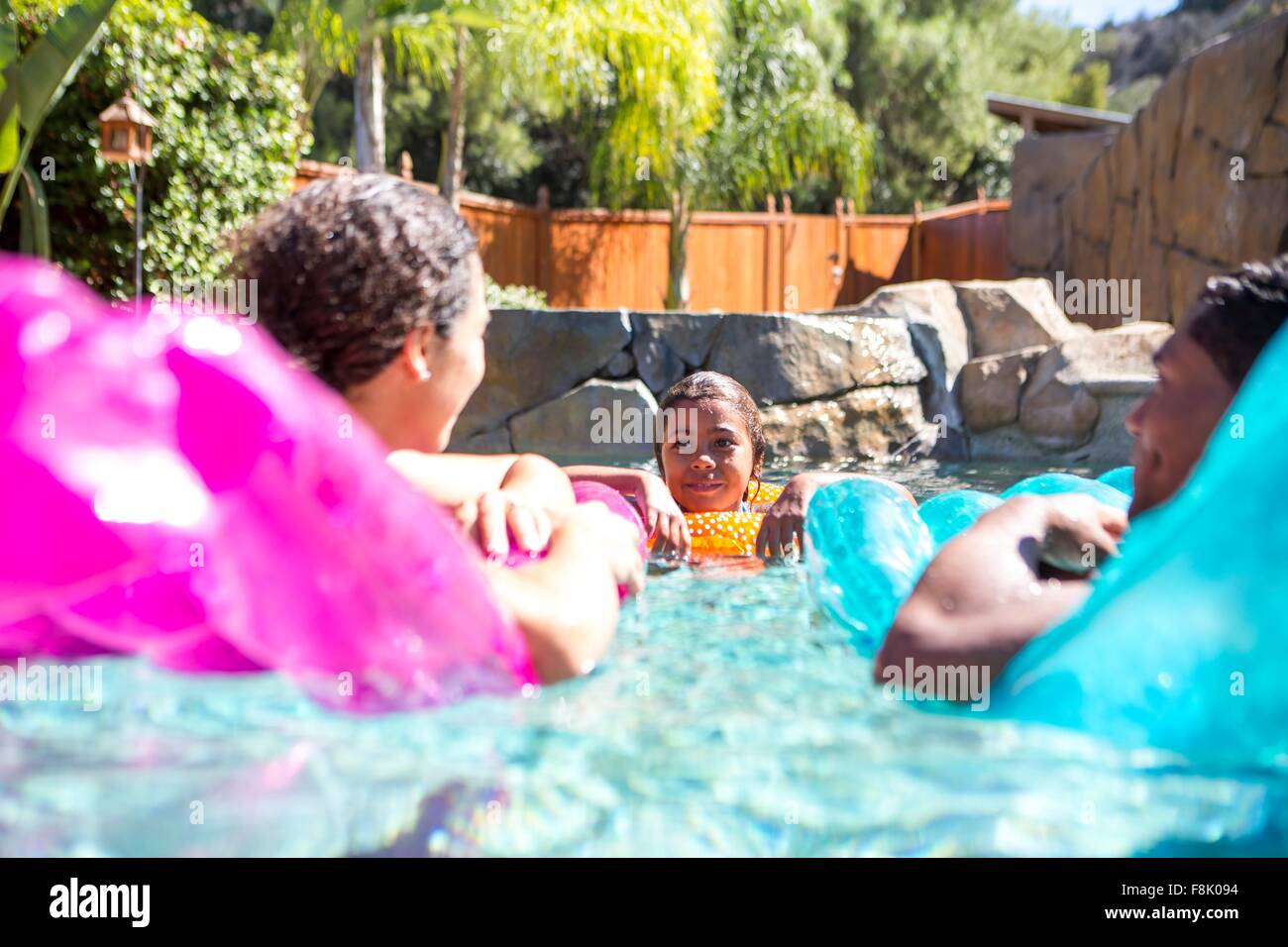 Family using swimming pool hi-res stock photography and images - Alamy