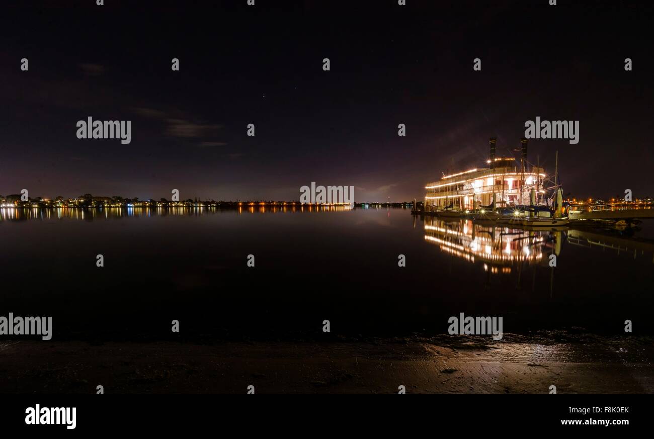Night view of an authentic, vintage, American riverboat with two ...