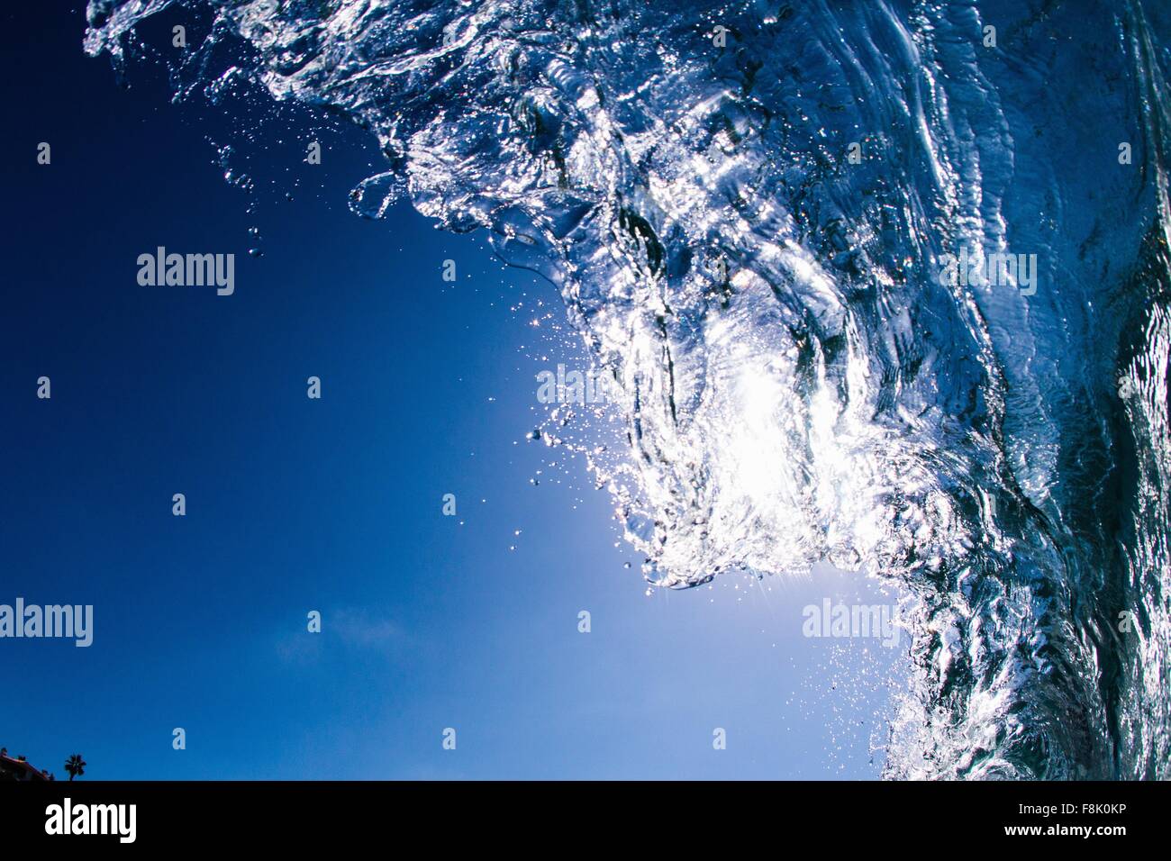 Low angle view of blue ocean wave rolling and splashing overhead Stock ...