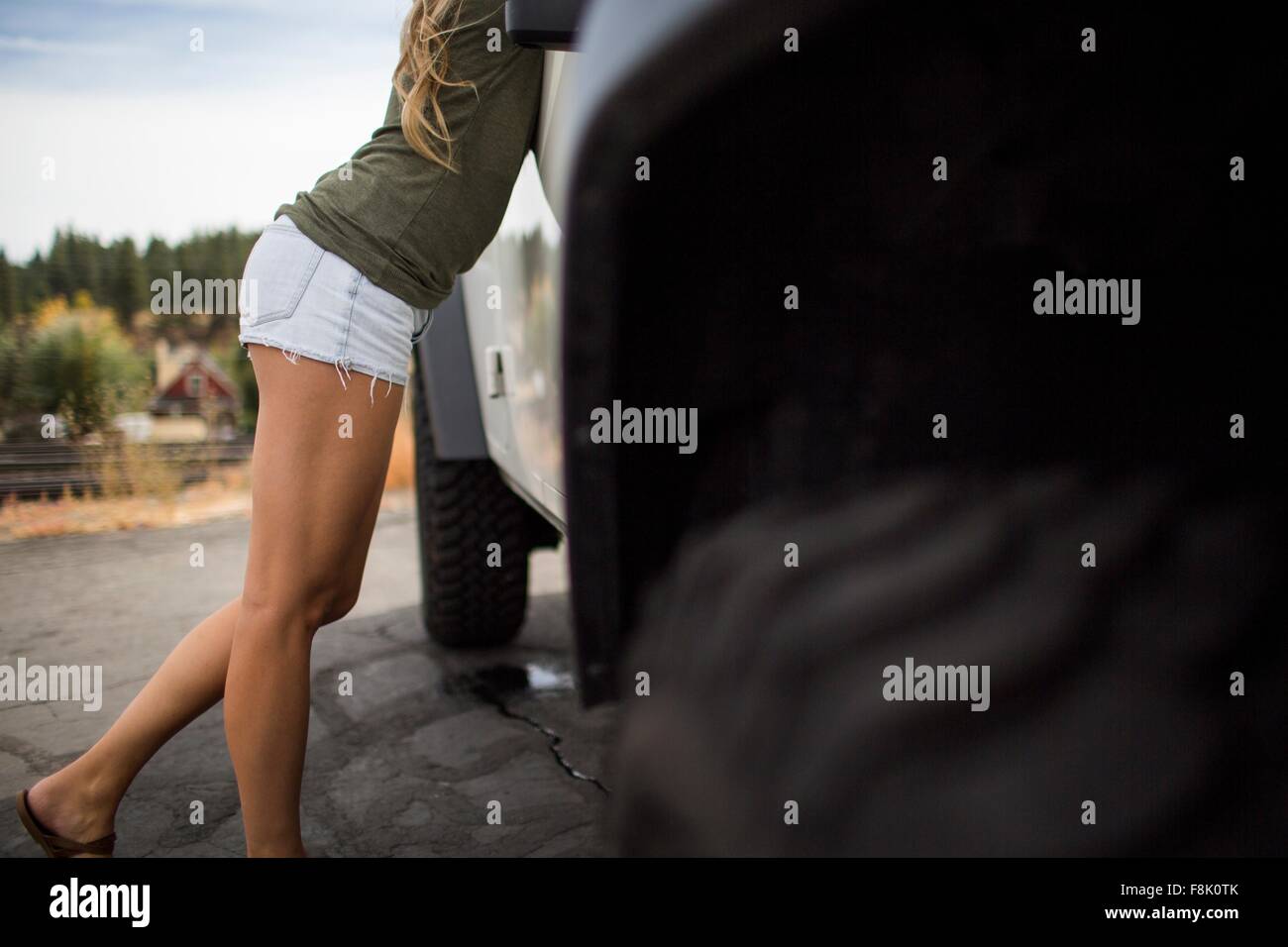 Leaning forward young woman hi-res stock photography and images - Alamy