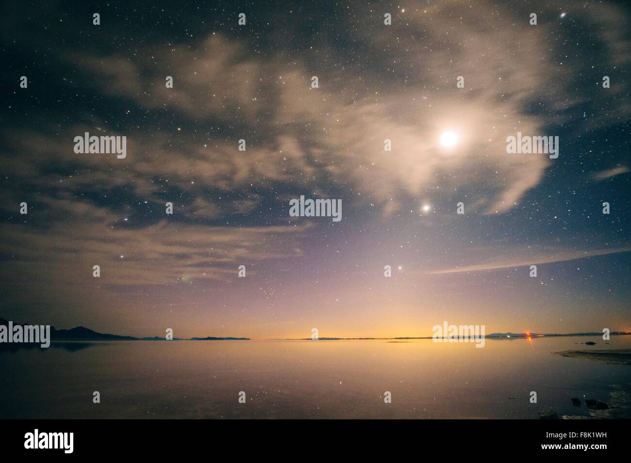 Full moon and starry evening sky over water, Bonneville, Utah, USA ...