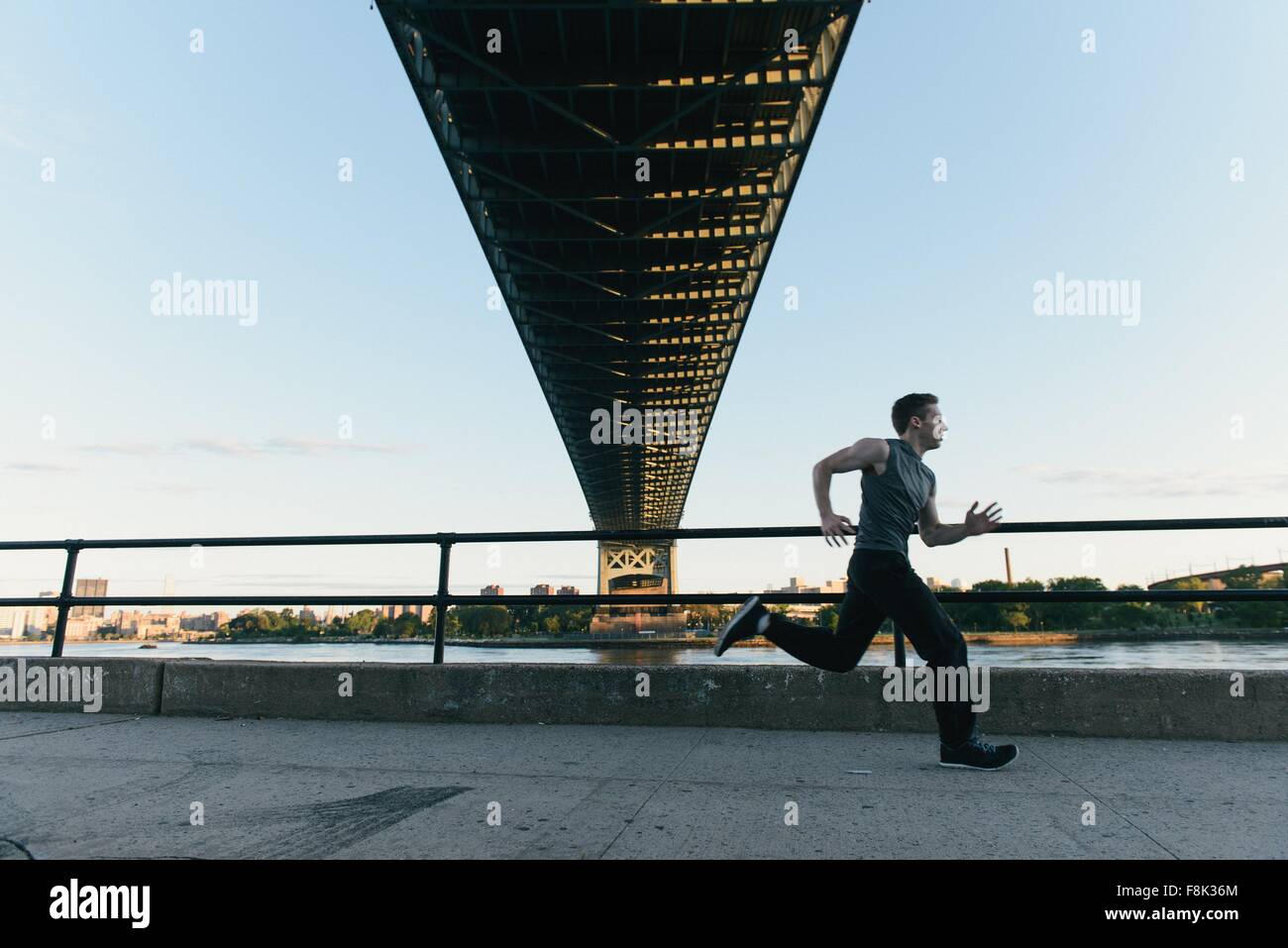Young man running, outdoors Stock Photo - Alamy