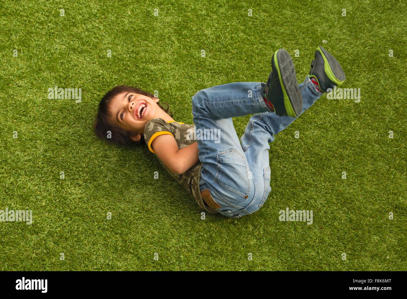 Boy Lying On Grass Legs High Resolution Stock Photography and Images ...