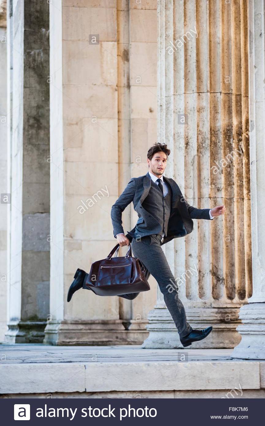 Man In Suit Running Stock Photos & Man In Suit Running Stock Images - Alamy