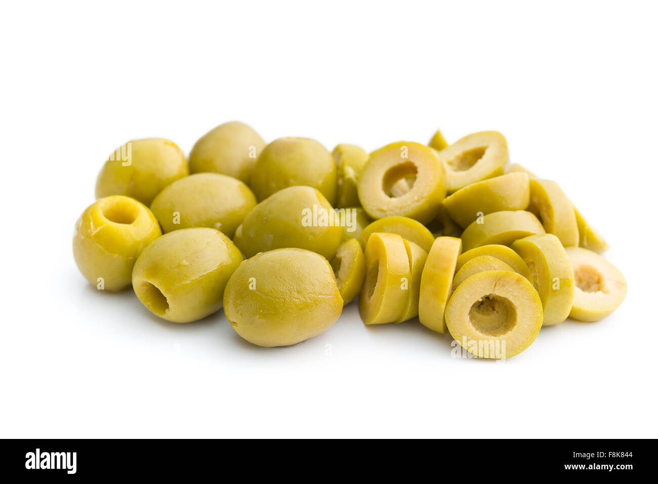 sliced green olives on white background Stock Photo - Alamy