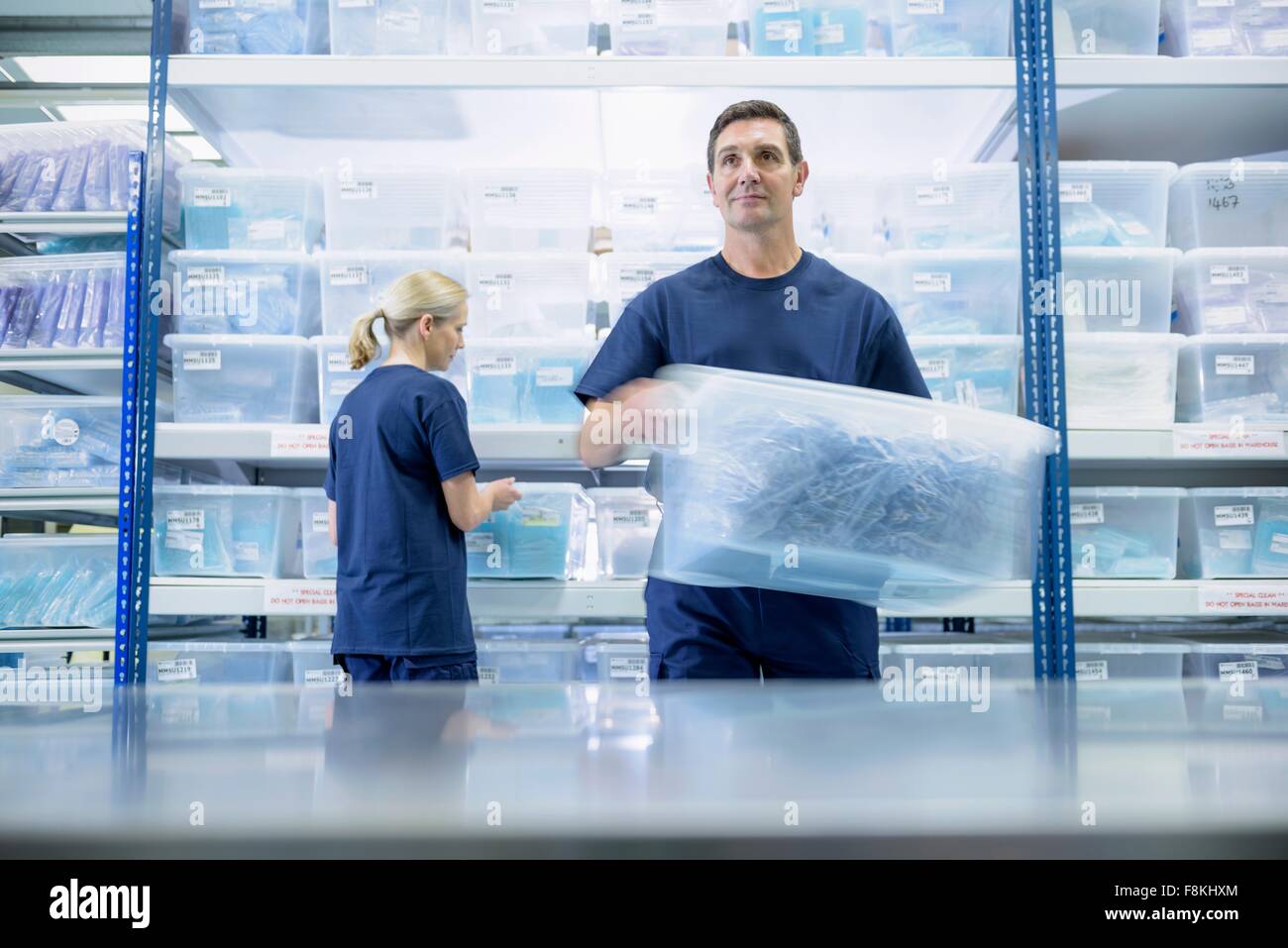 Warehouse workers in surgical instrument factory Stock Photo - Alamy
