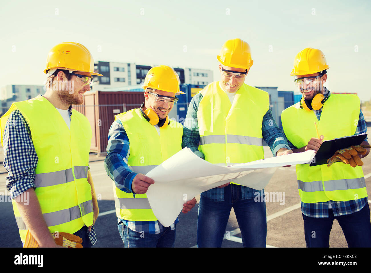 group of builders with tablet pc and blueprint Stock Photo - Alamy