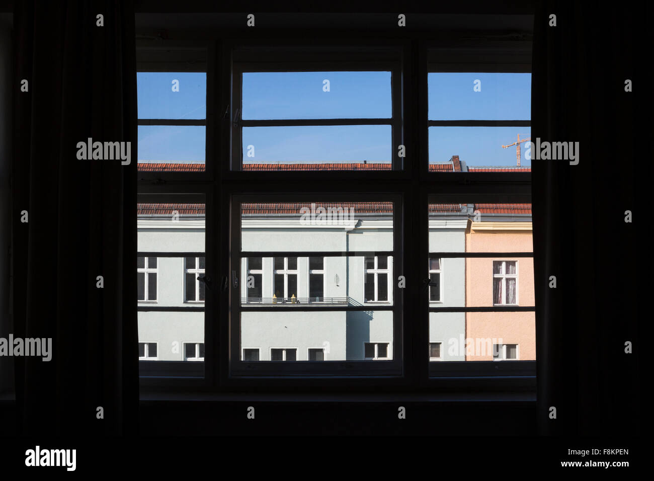 View of buildings and blue sky through an art deco style window Stock ...