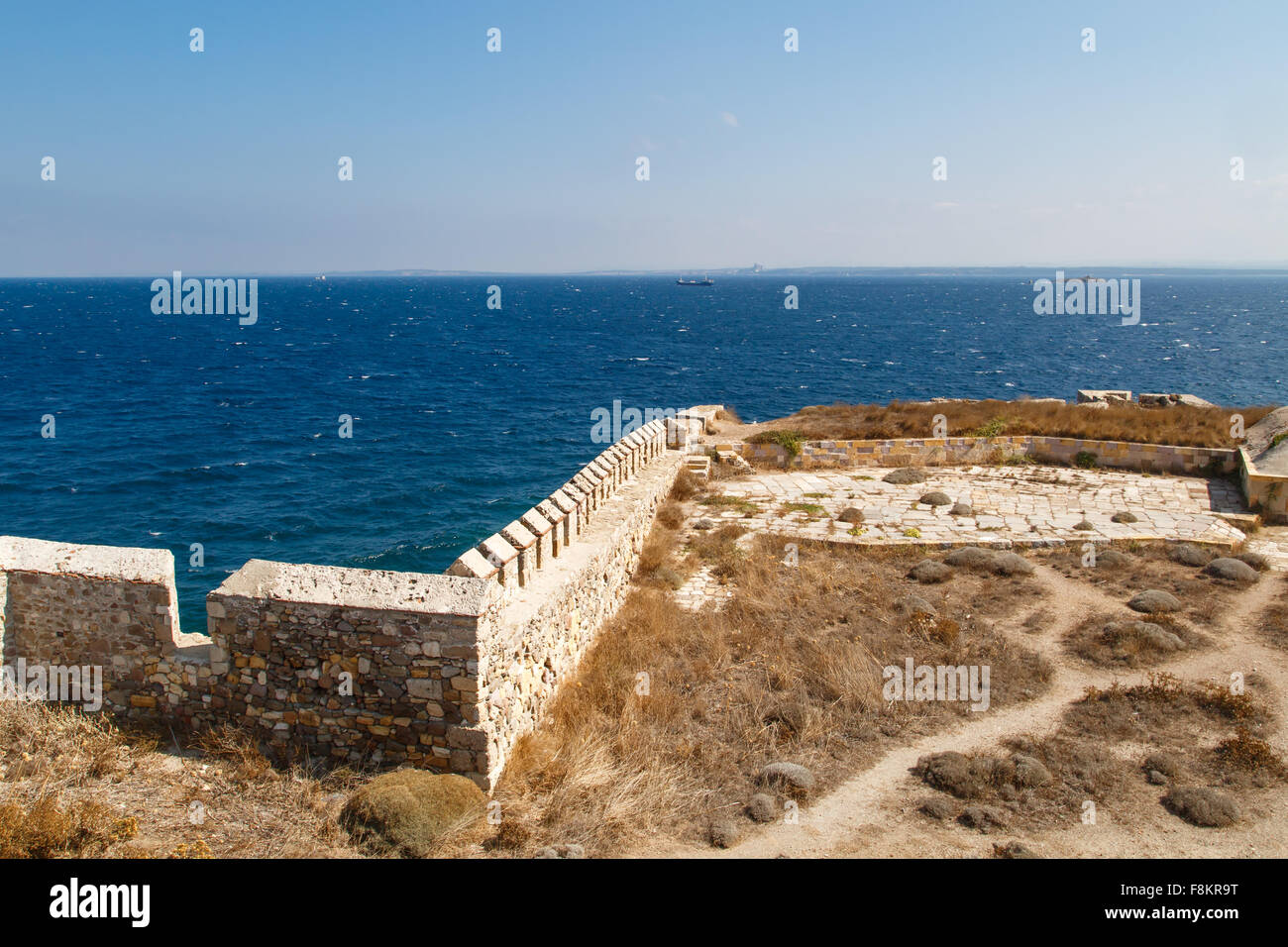 Medieval castle in Tenedos, Bozcaada, Turkey at seacoastline Stock ...