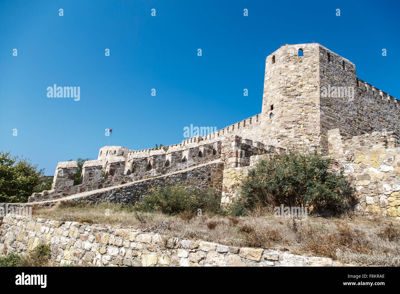Medieval castle in Tenedos, Bozcaada, Turkey at seacoastline Stock ...