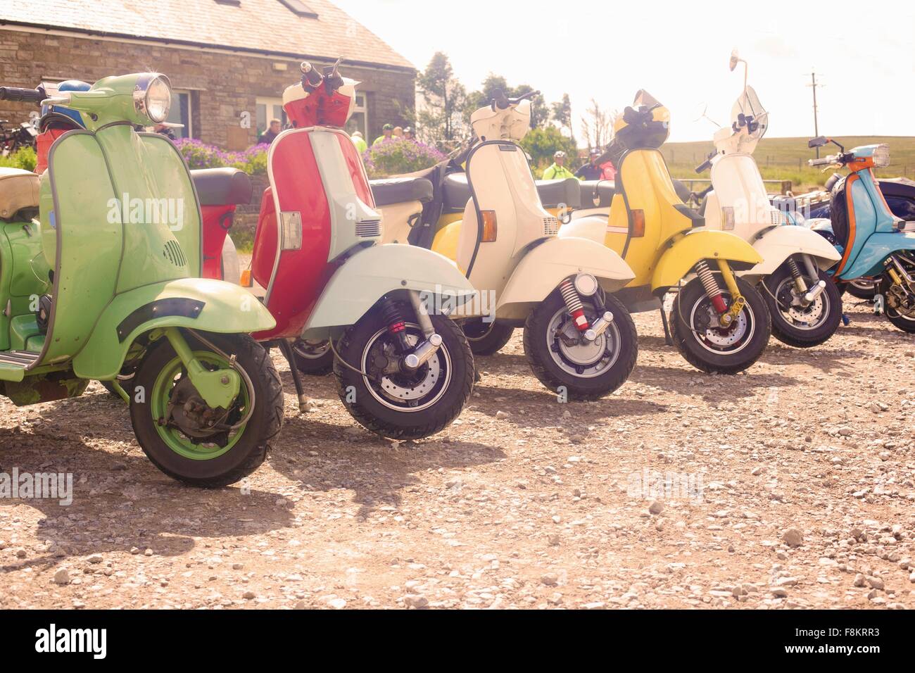 Colourful scooters parked in a row Stock Photo - Alamy