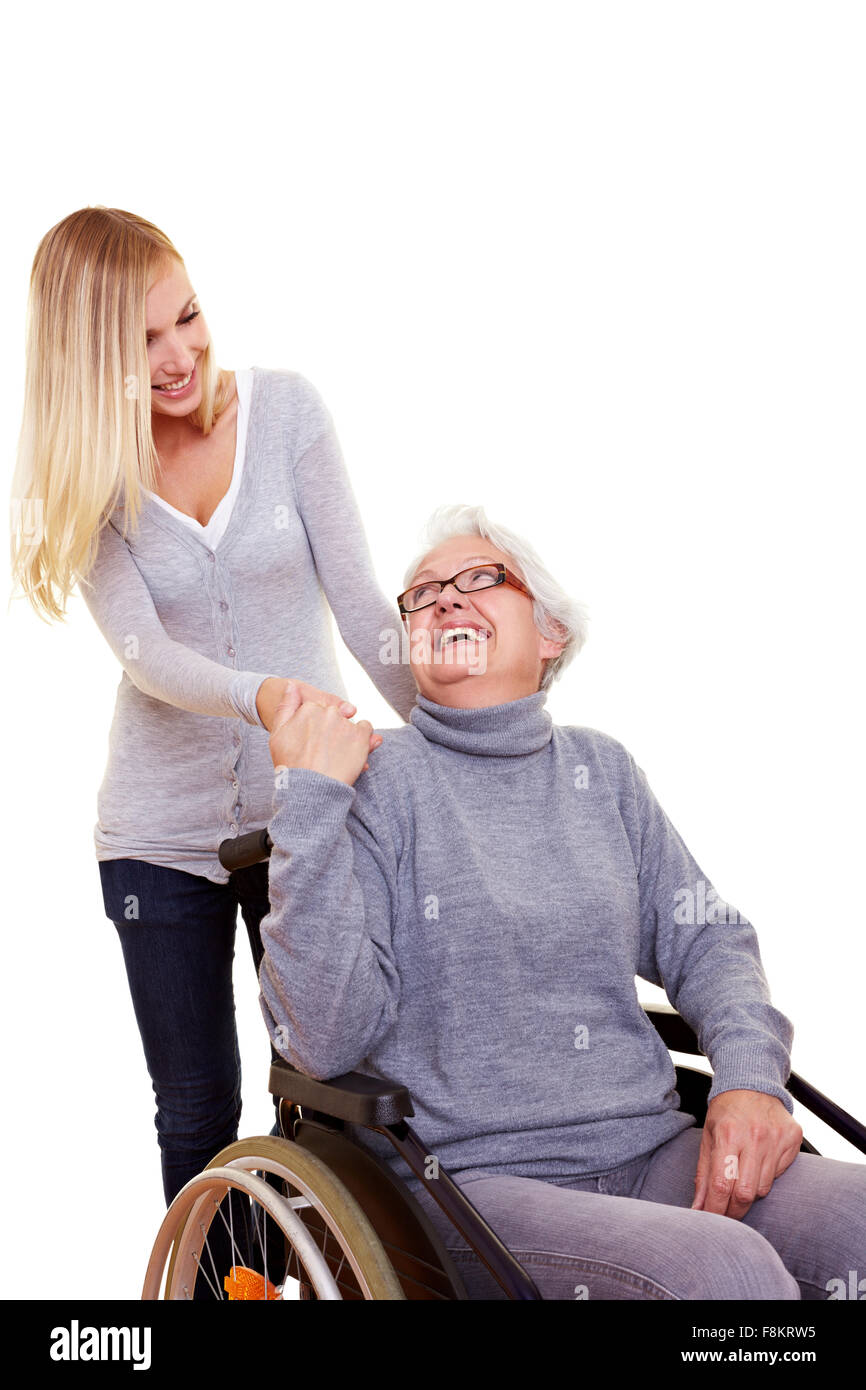 Young woman reaching out to an elderly handicapped woman Stock Photo ...