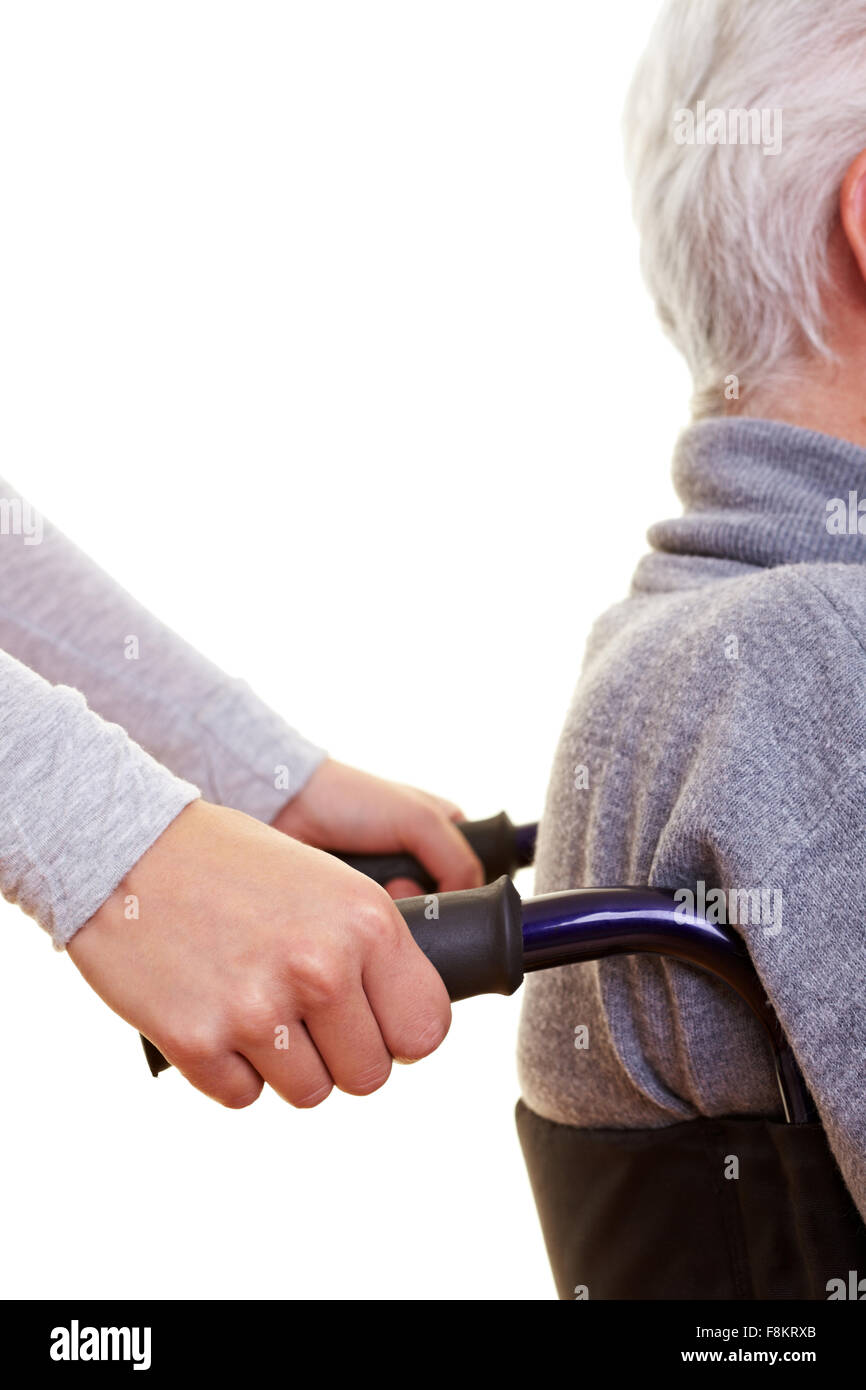 Hands pushing elderly person in a wheelchair Stock Photo - Alamy