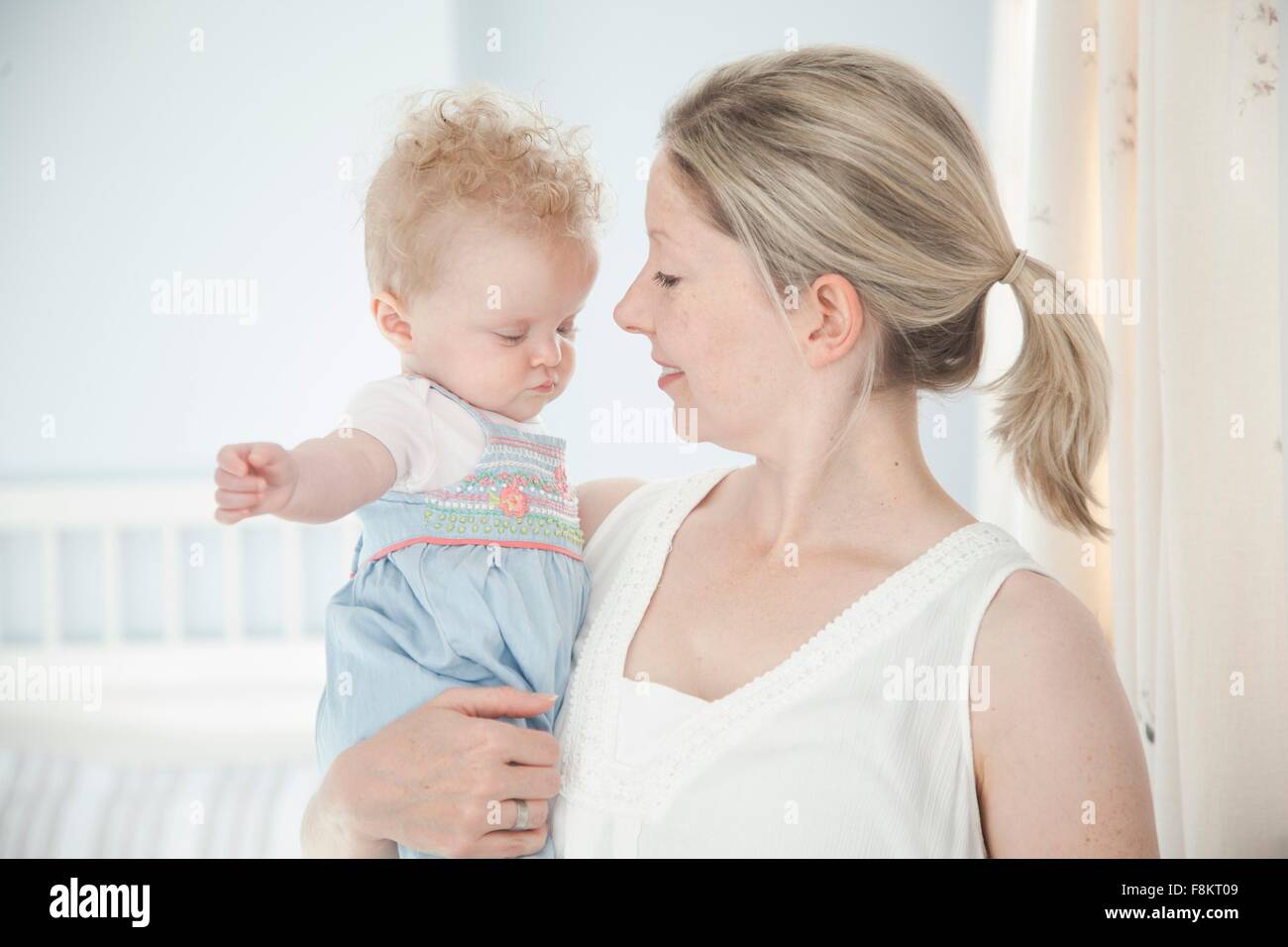 Mother holding baby daughter Stock Photo - Alamy Mother holding baby daughter Stock Photo - Alamy