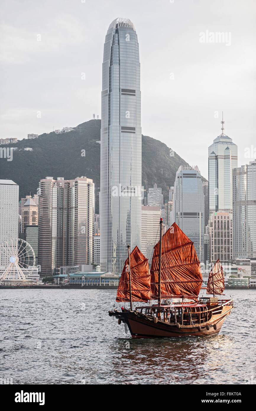 Traditional Chinese junk sailing at Victoria harbour in Hong Kong ...