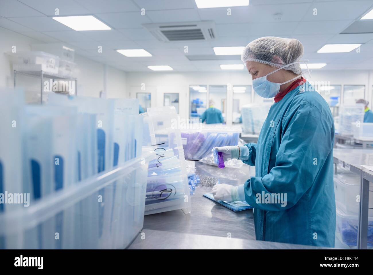 Workers pack surgical instruments in clean room of surgical instruments ...
