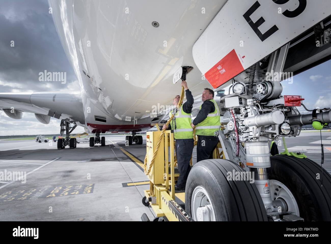Ground crew operating loading equipment on A380 aircraft Stock Photo ...