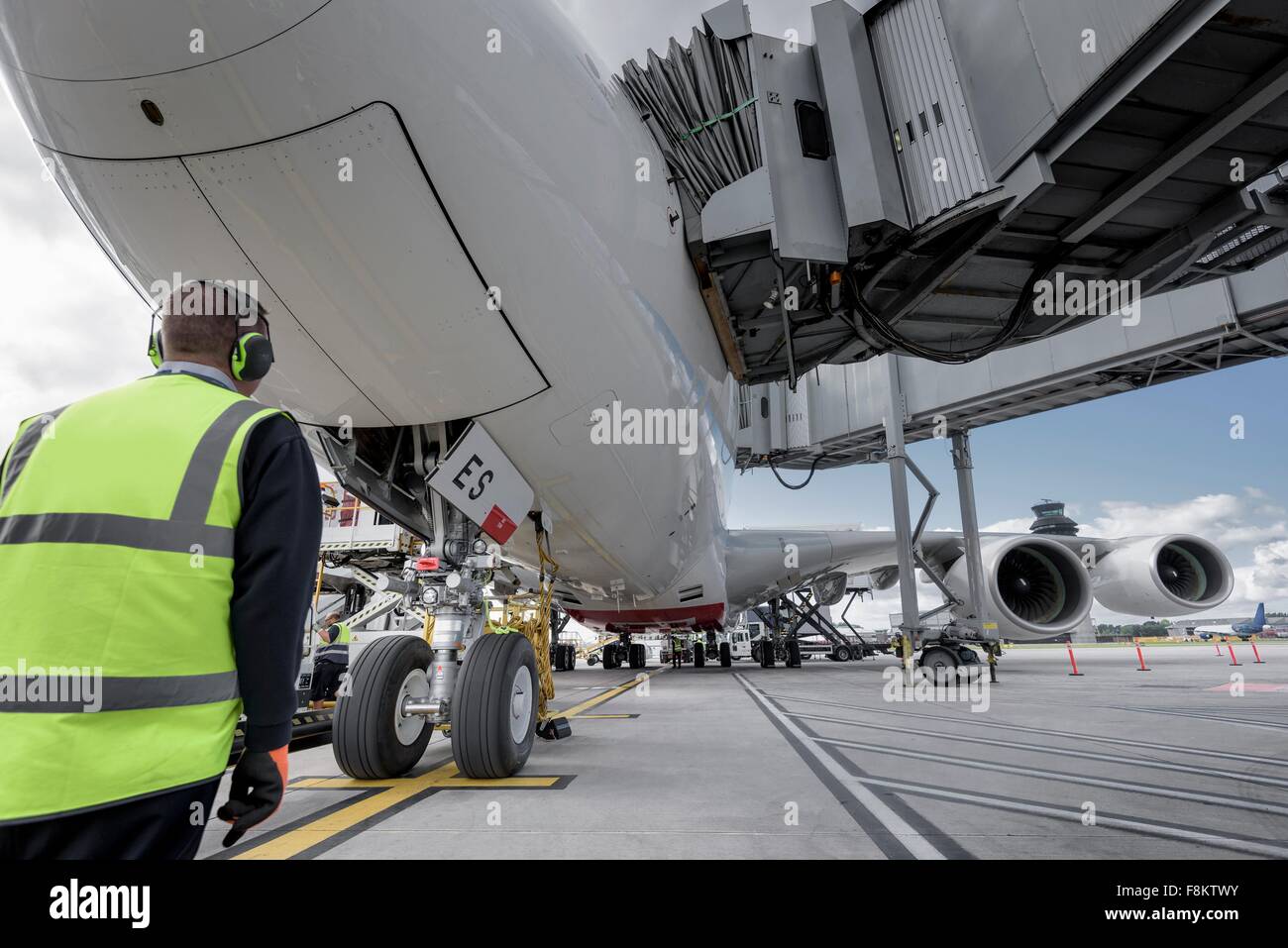 Engineer inspecting A380 aircraft at stand in airport Stock Photo - Alamy