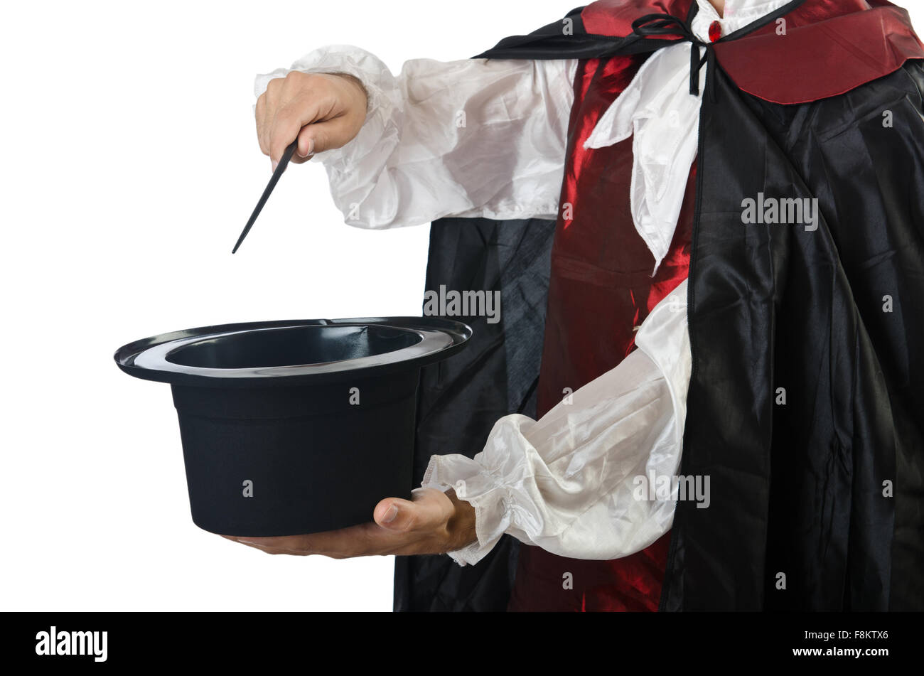 Magician doing tricks on white Stock Photo - Alamy