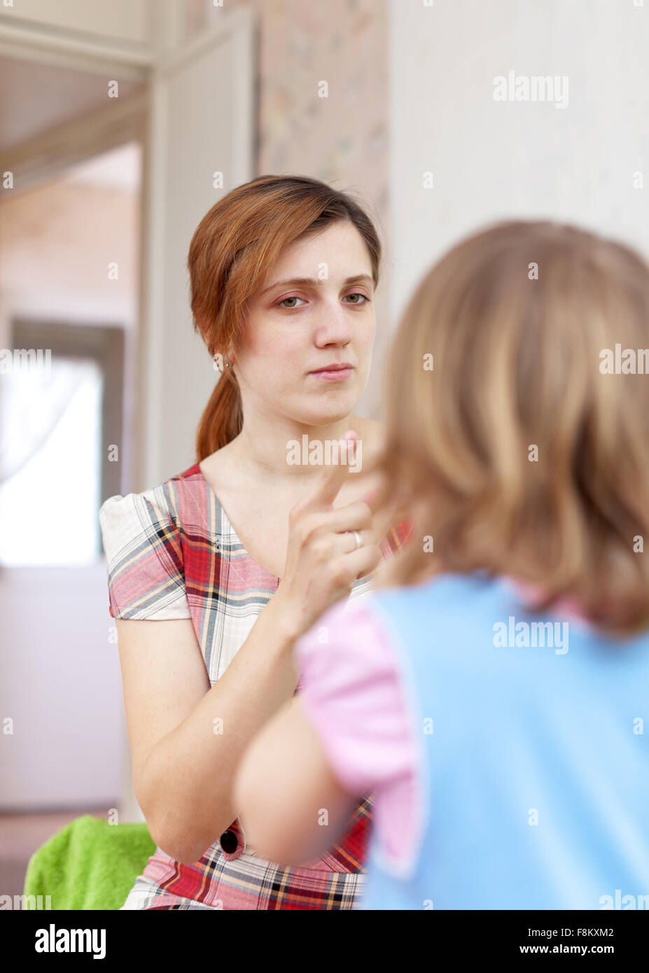 Mother scolds her child in home Stock Photo - Alamy