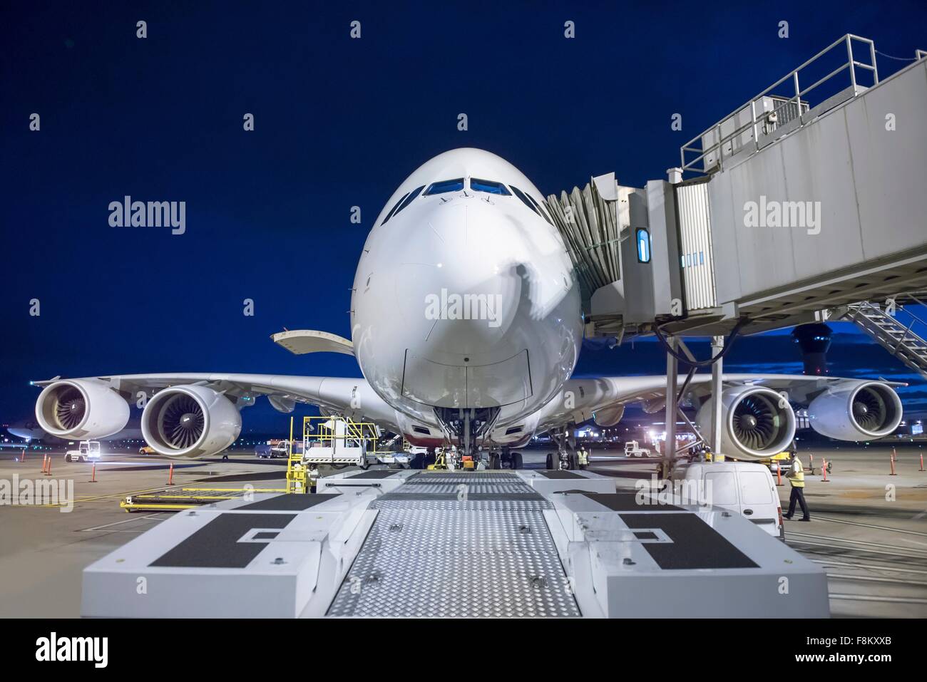 Chief engineer inspecting A380 aircraft on runway at night Stock Photo ...