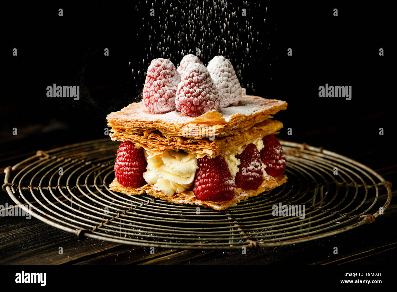 Millefeuille dessert with raspberry on black background Stock Photo - Alamy