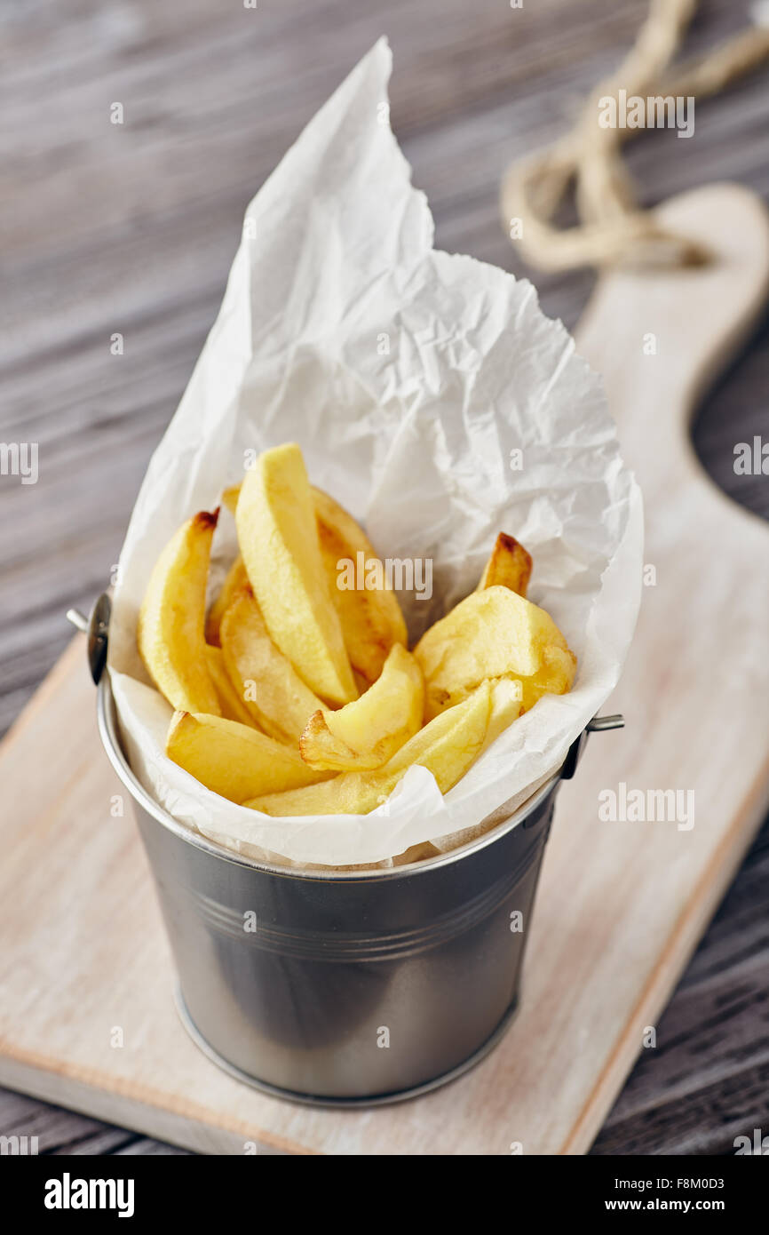 Fries in a bucket, country style Stock Photo - Alamy