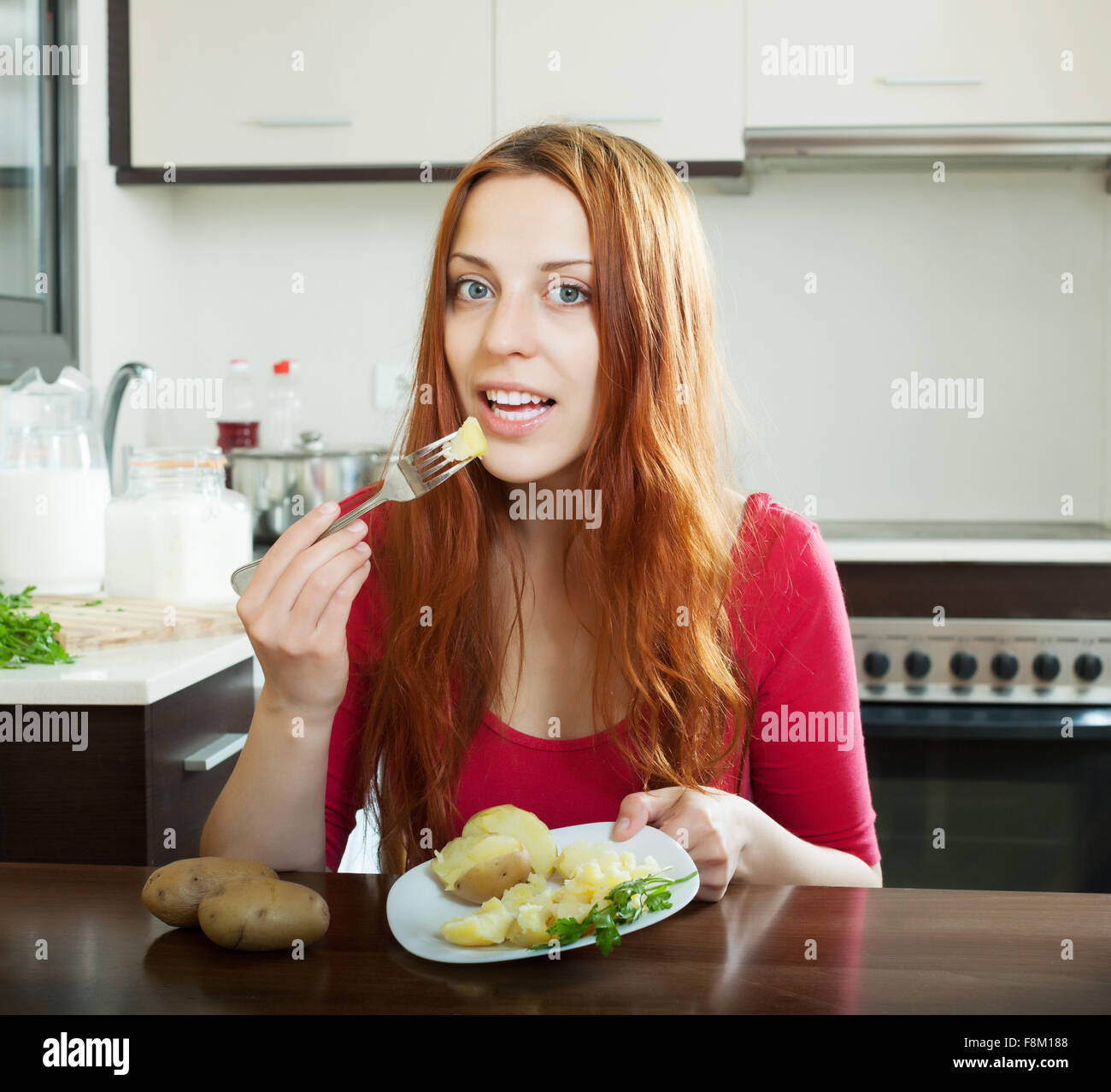 Person eating boiled potatoes hi-res stock photography and images - Alamy