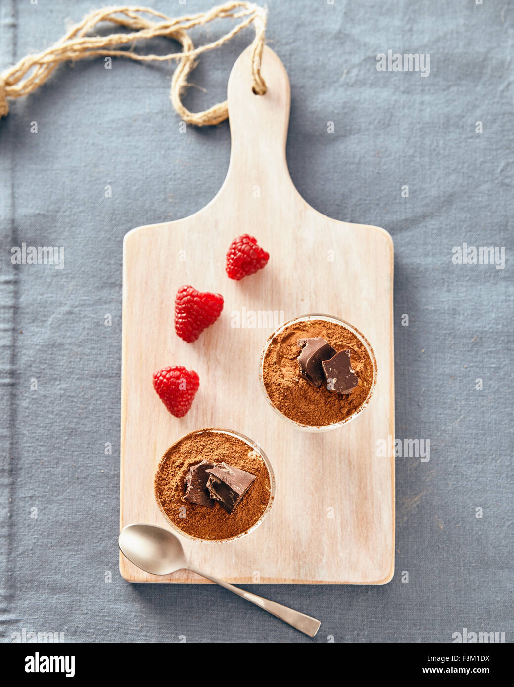 Panna cotta with chocolate on a white chopping board, bright colors ...
