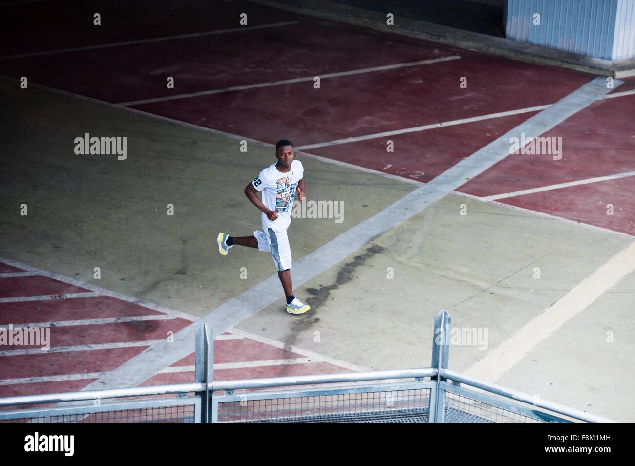 Young man exercising, running, outdoors, elevated view Stock Photo - Alamy