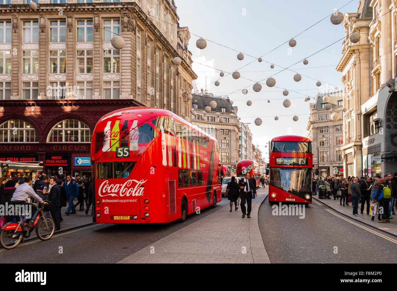 London's Oxford Street full of shoppers, several red London Buses Stock ...