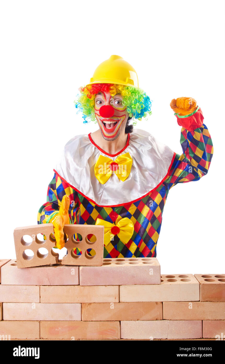 Bad construction concept with clown laying bricks Stock Photo - Alamy