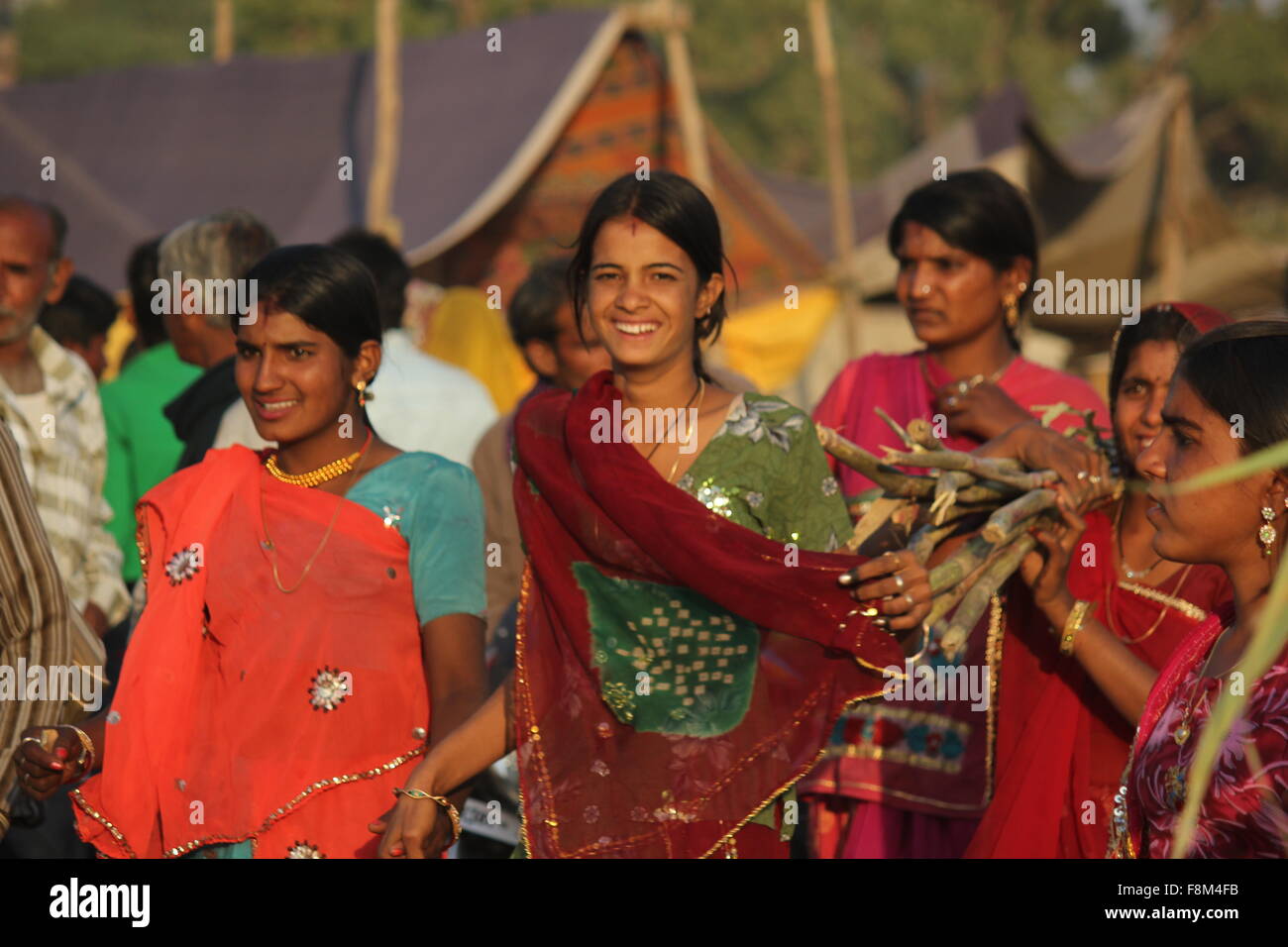 PUSHKAR, INDIA - NOV 28: Indian girls with traditional colored saree on ...