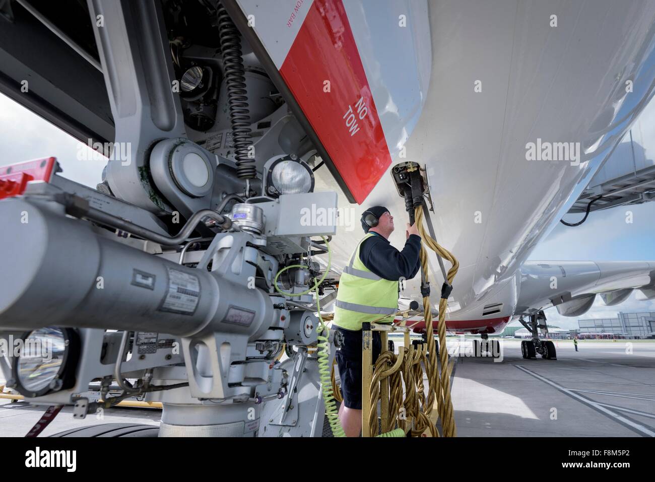 Ground crew service worker with A380 aircraft Stock Photo - Alamy