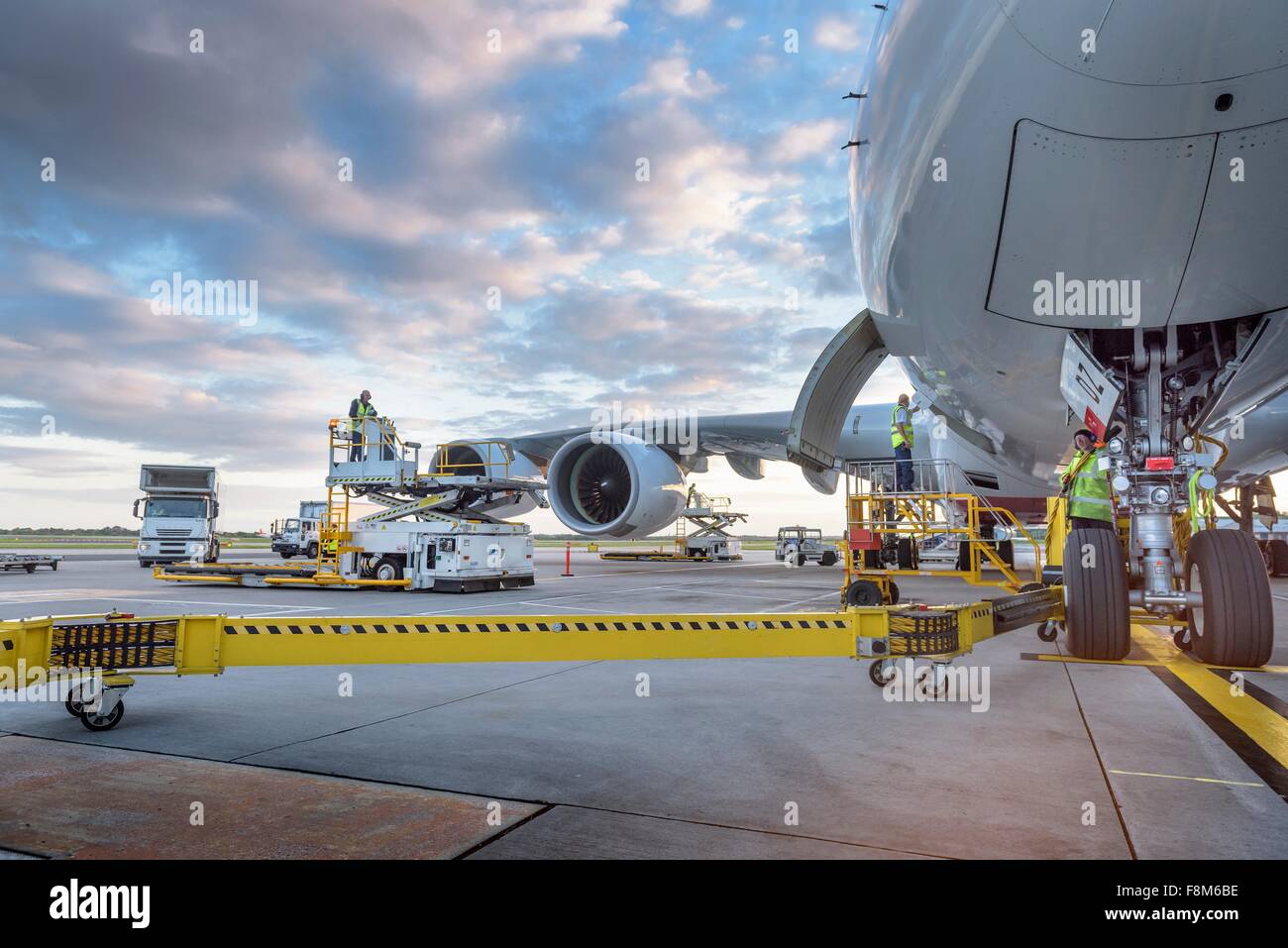Ground crew attending to A380 aircraft at airport Stock Photo - Alamy