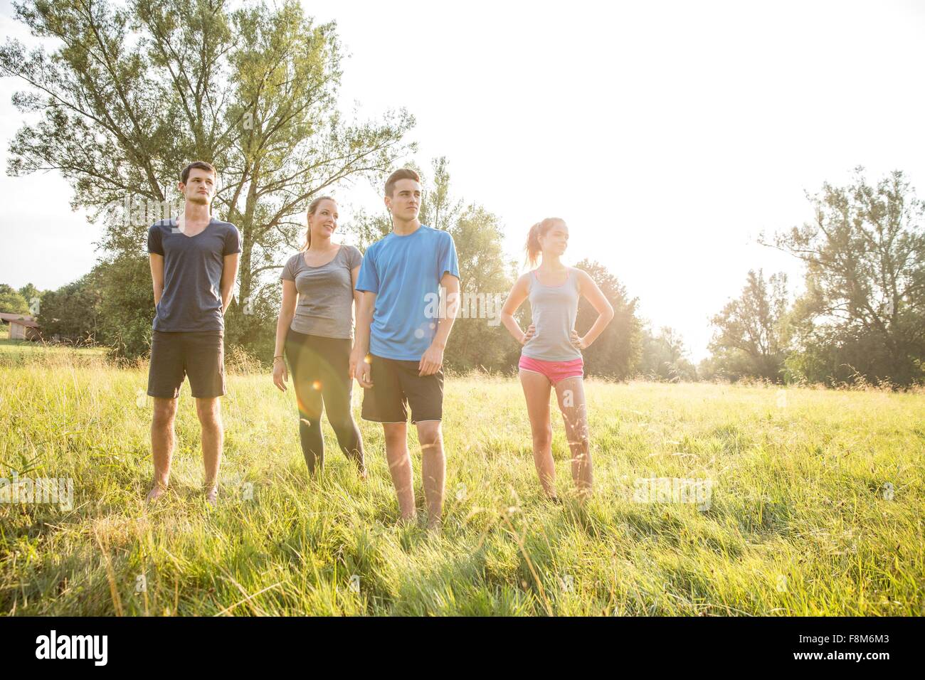 Group four people standing hi-res stock photography and images - Alamy